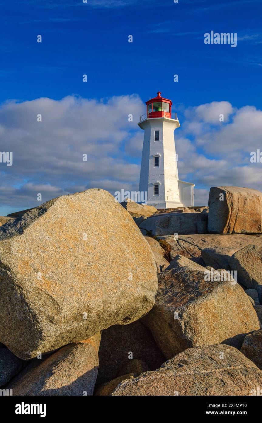 The iconic lighthouse at Peggy's Cove, Nova Scotia is situated on an ...