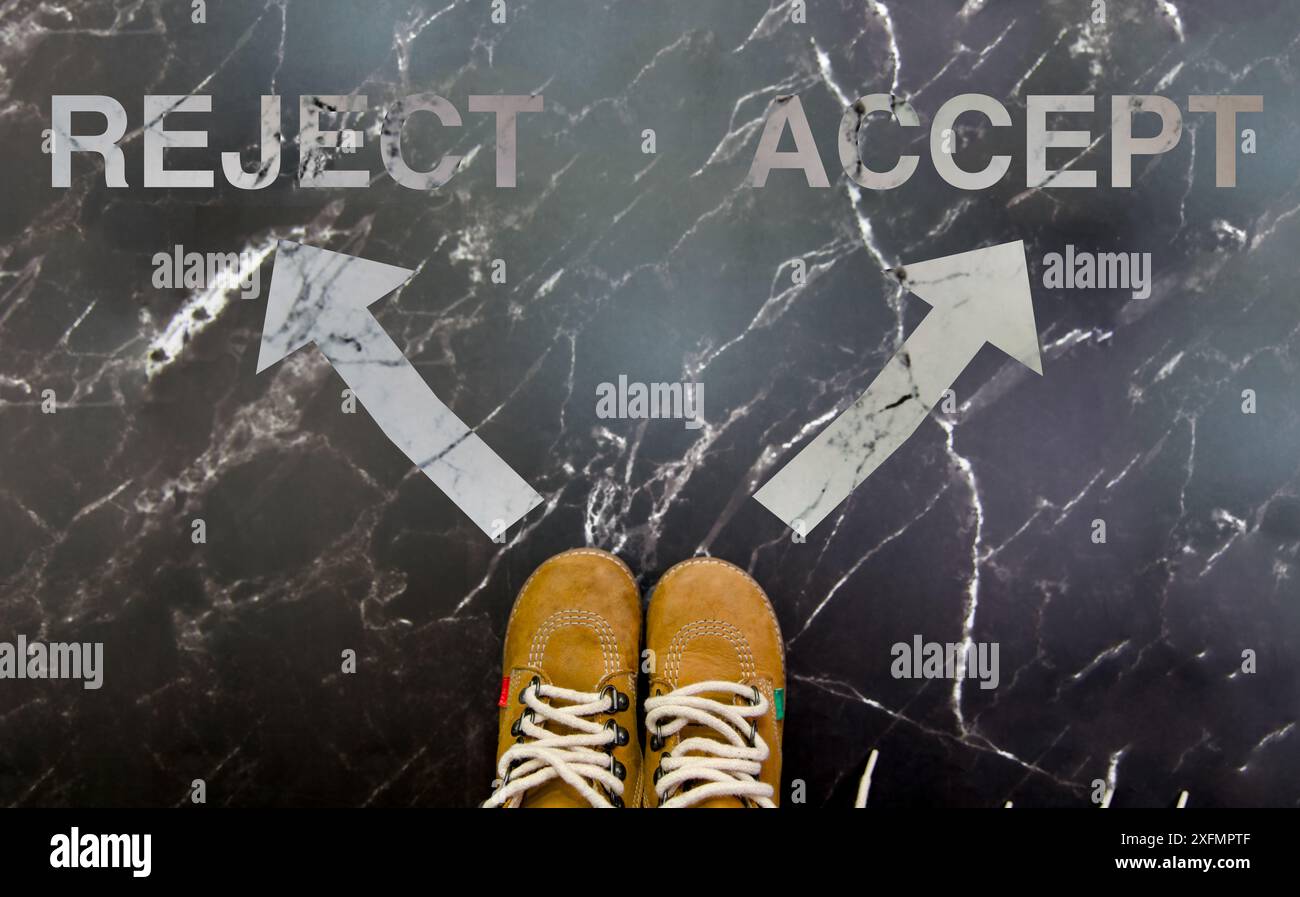 Top view of person's feet standing on a marble floor with arrows ...