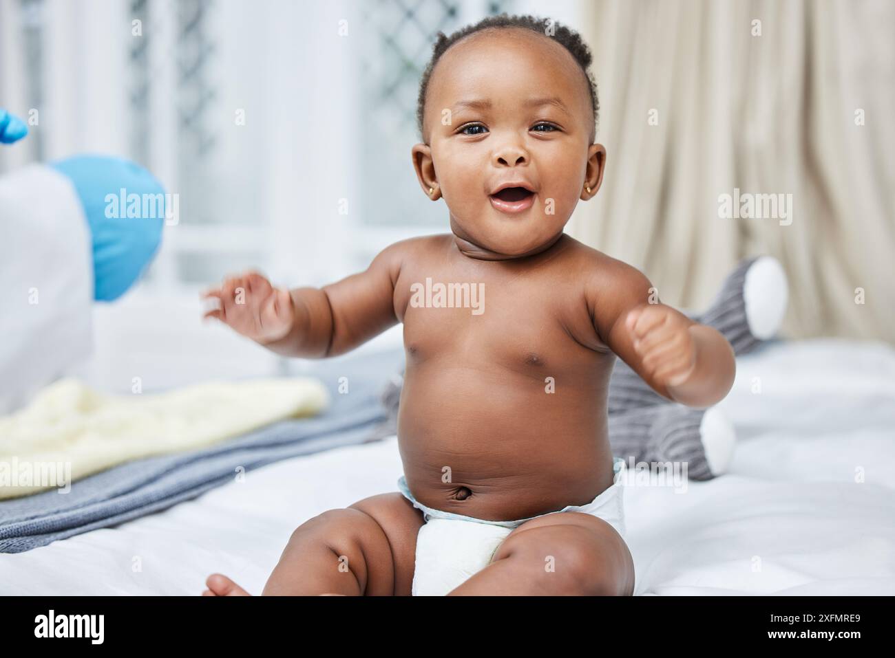 Portrait, African and newborn baby in clinic for care, growth ...