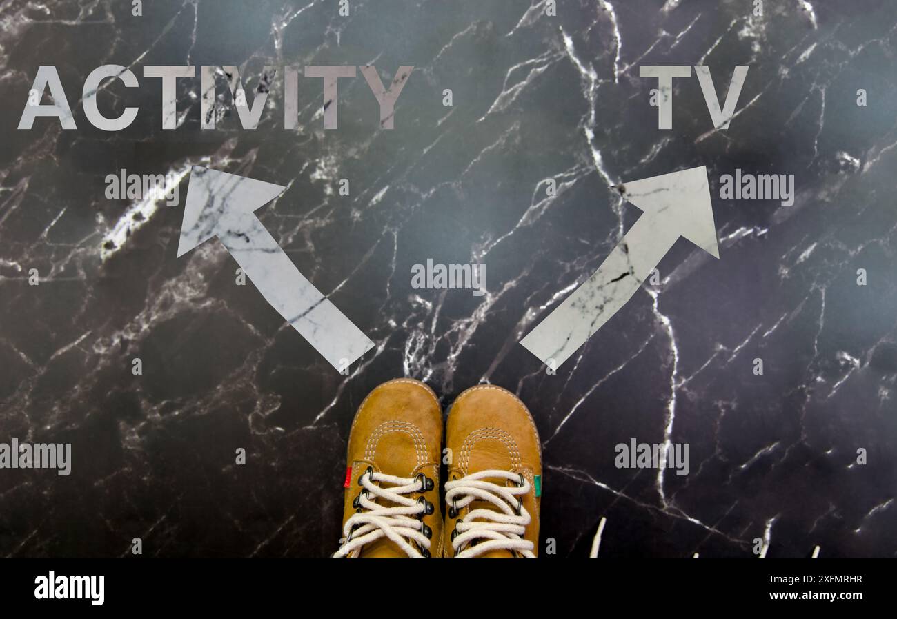 Top view of a choice between physical activity and watching TV ...