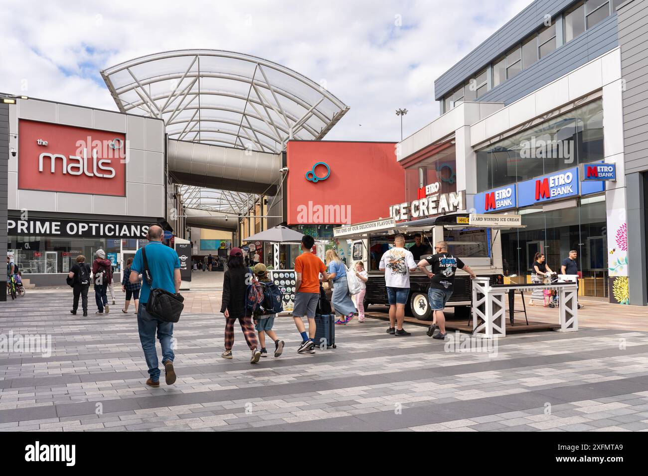 Shoppers and visitors in 'The Malls' on a summer's day, an outdoor covered pedestrianised ...