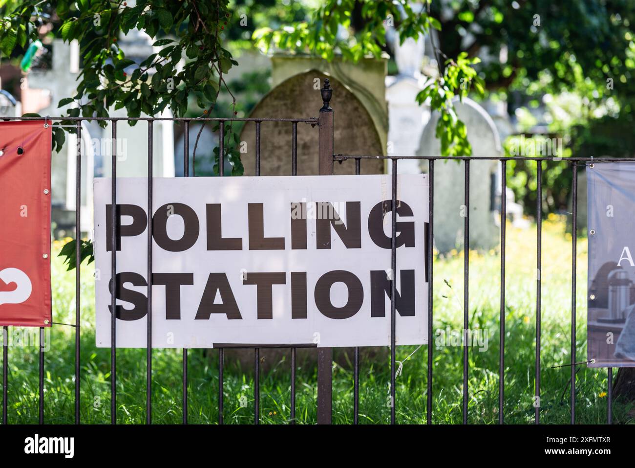 Polling station sign in a church graveyard in St John's Southend ...