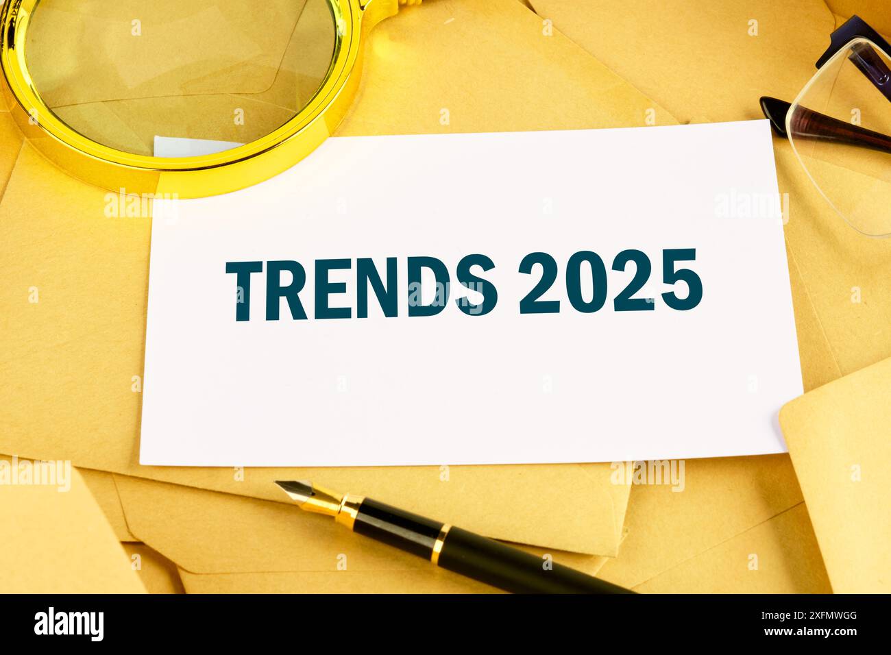 Trend 2025 on a white business card lying on postal envelopes Stock ...