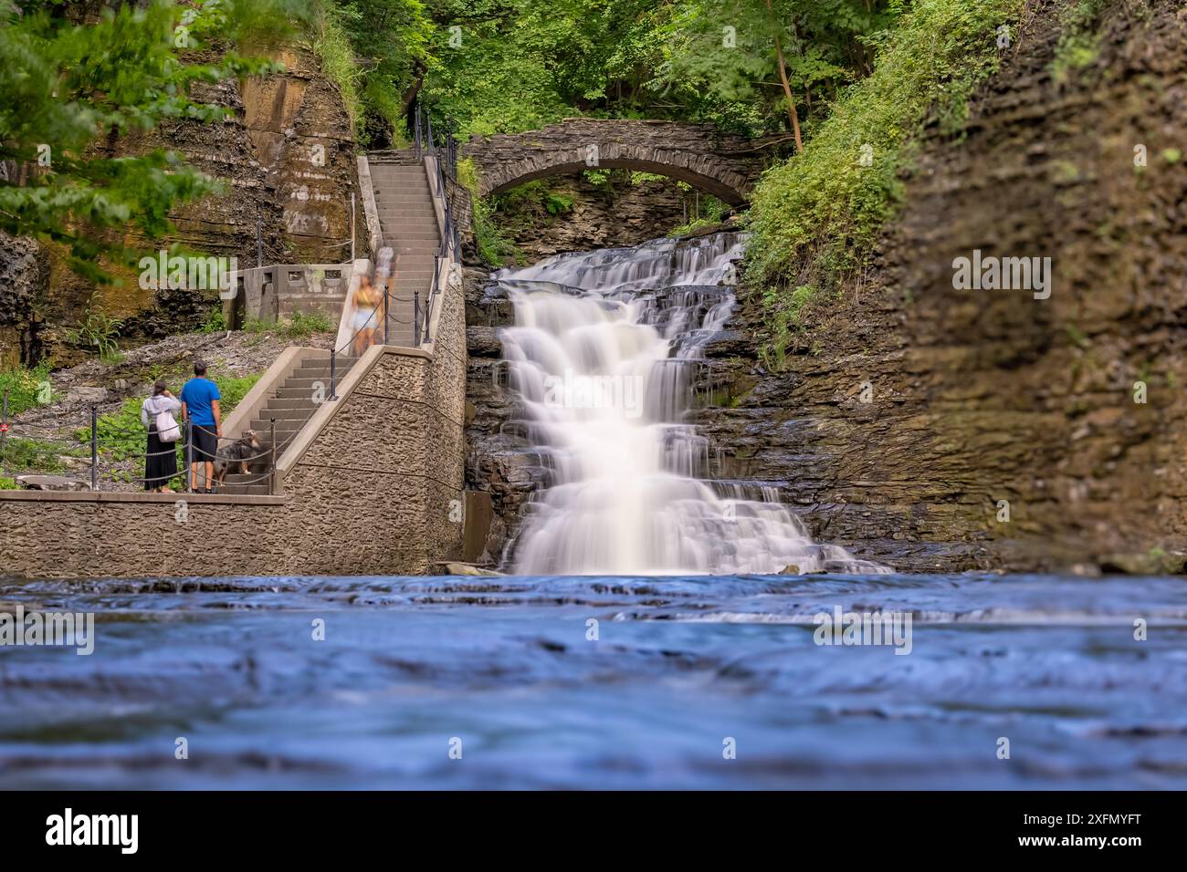 Photo of a waterfall with a trail / concrete stairs, Cascadilla Gorge ...