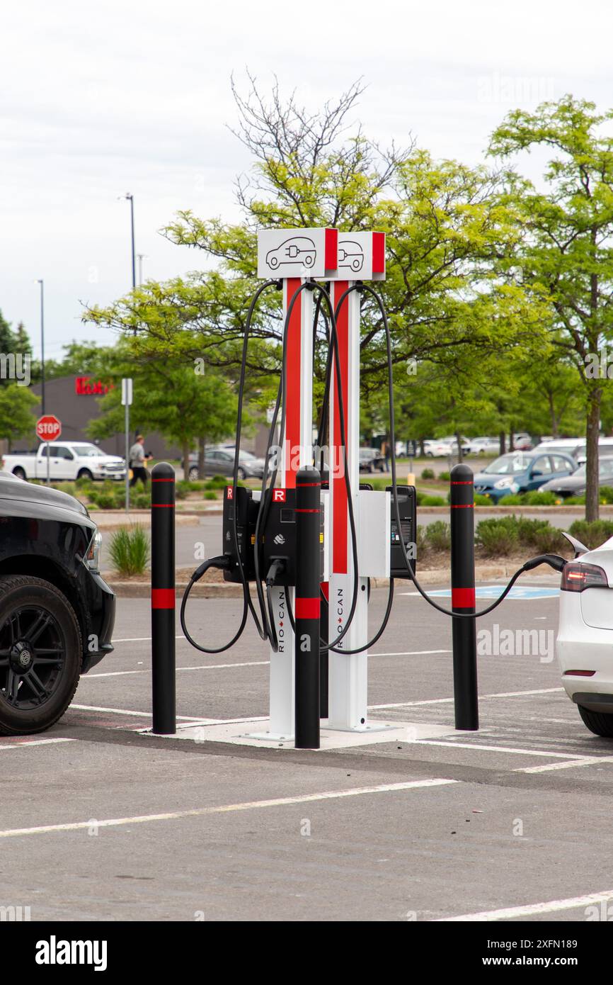 Kanata, Canada - June 2, 2024: Electric car plug in charging station at ...