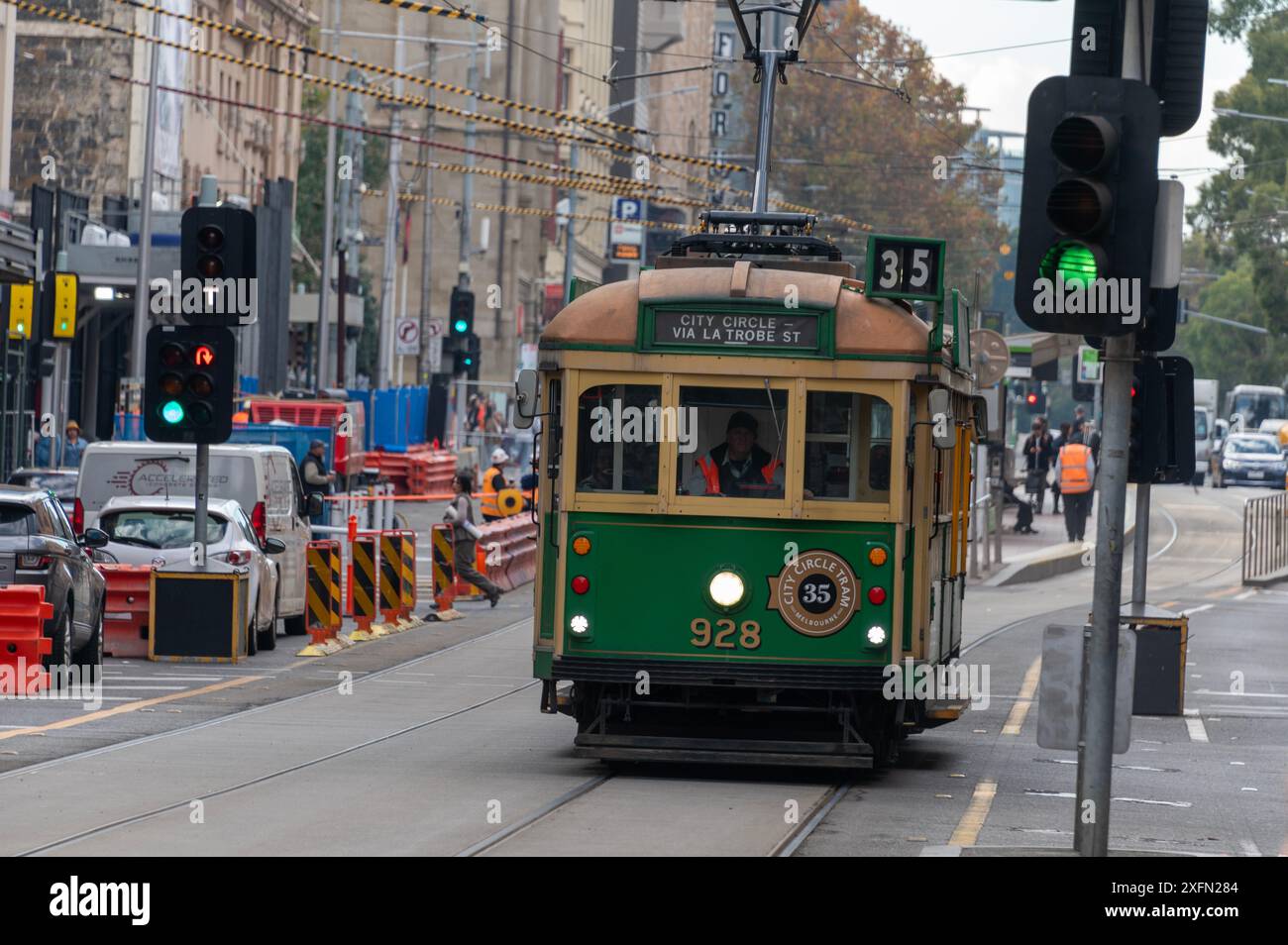 The free passenger ride No 35 green and yellow tram approaching the ...