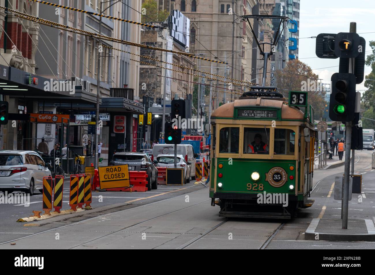 The free passenger ride No 35 green and yellow tram approaching the ...