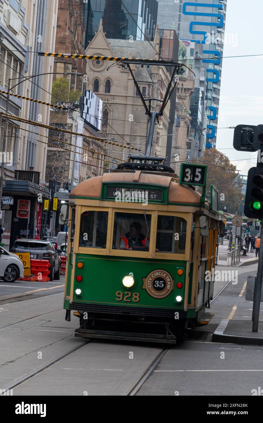 The free passenger ride No 35 green and yellow tram approaching the ...