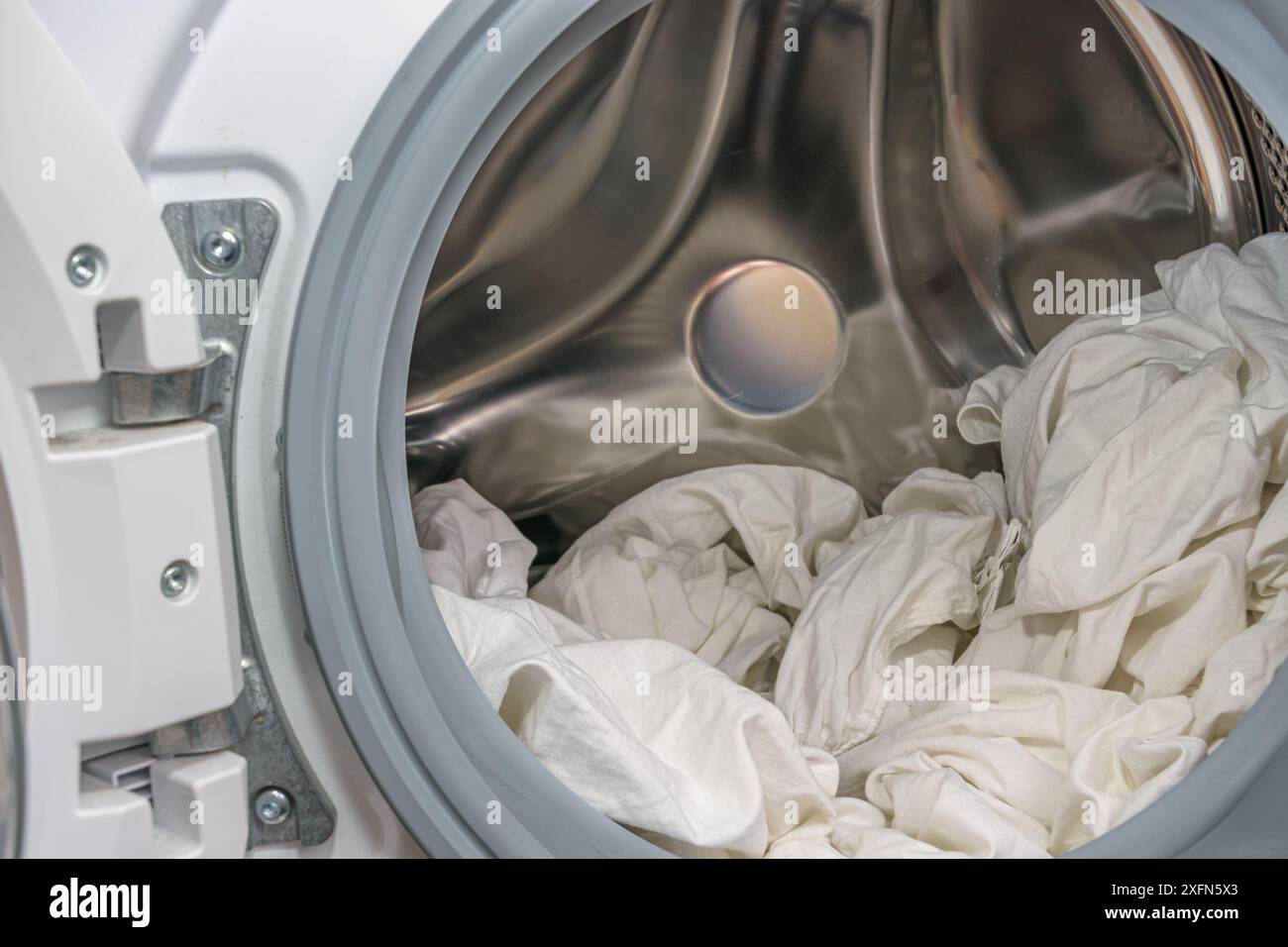 White clothes in a open washing machine. Laundry concept Stock Photo ...