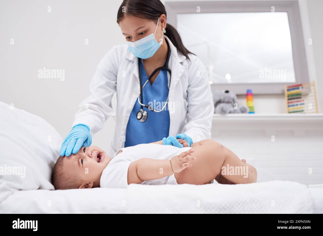 Baby, doctor and crying for fever in hospital, checkup and lungs for ...