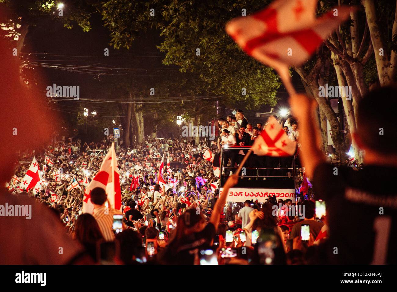 Tbilisi, Georgia - 2nd july, 2024: Football players on open-roof bus on ...