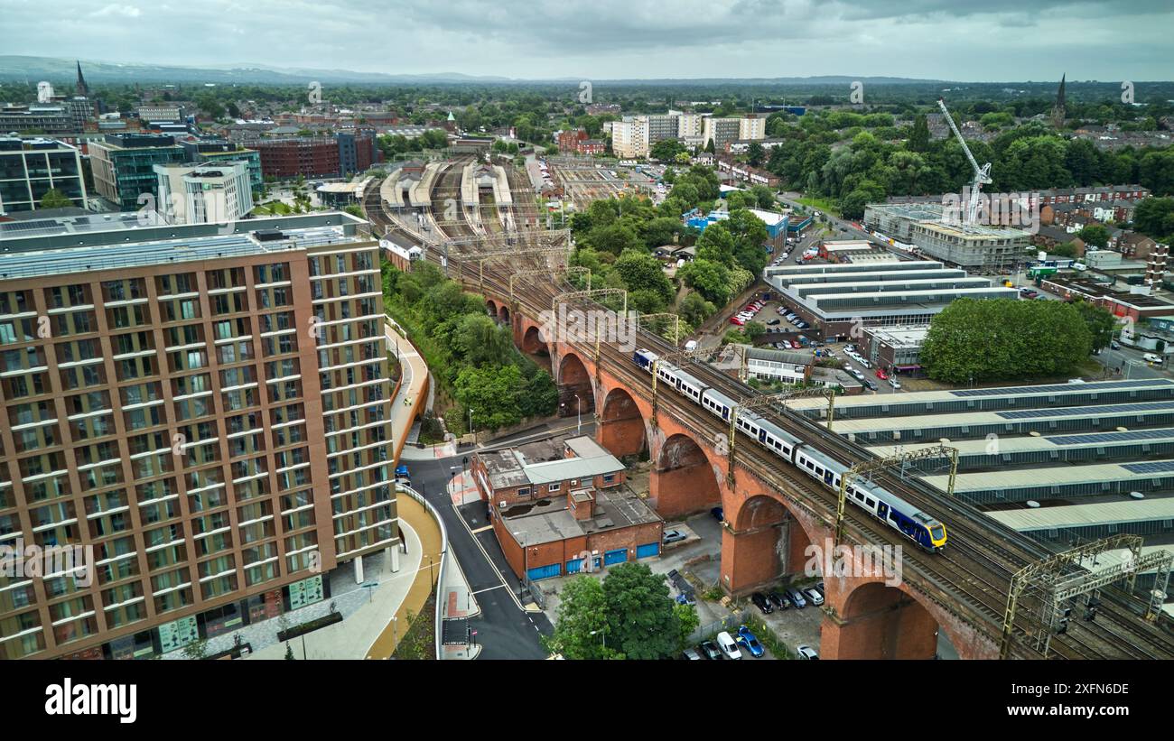 Stockport viaduct with a Northern local commuter train passing over on ...