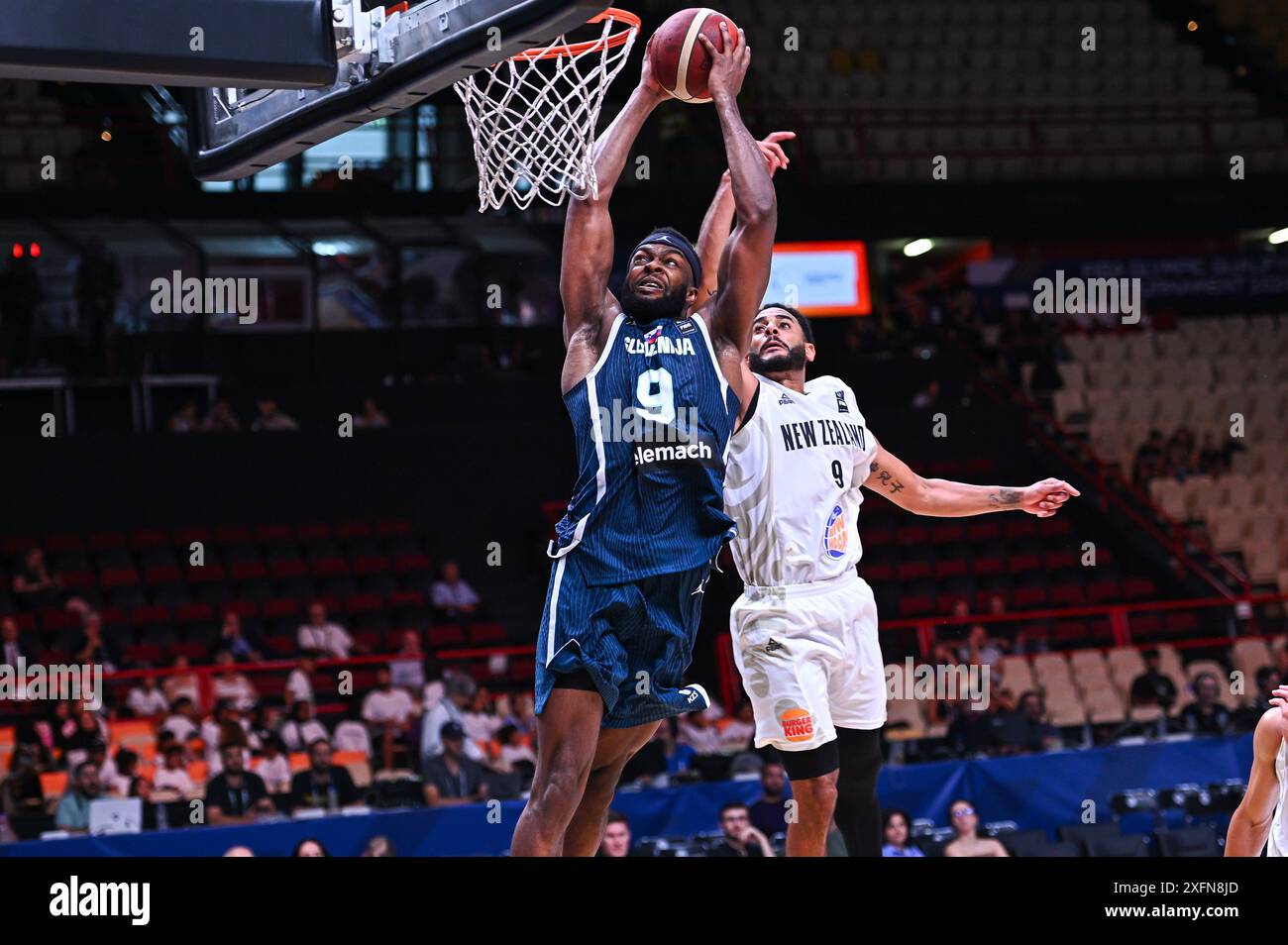 9 Josh Nebo of Slovenia competing with 9 Corey Webster of New Zealand ...