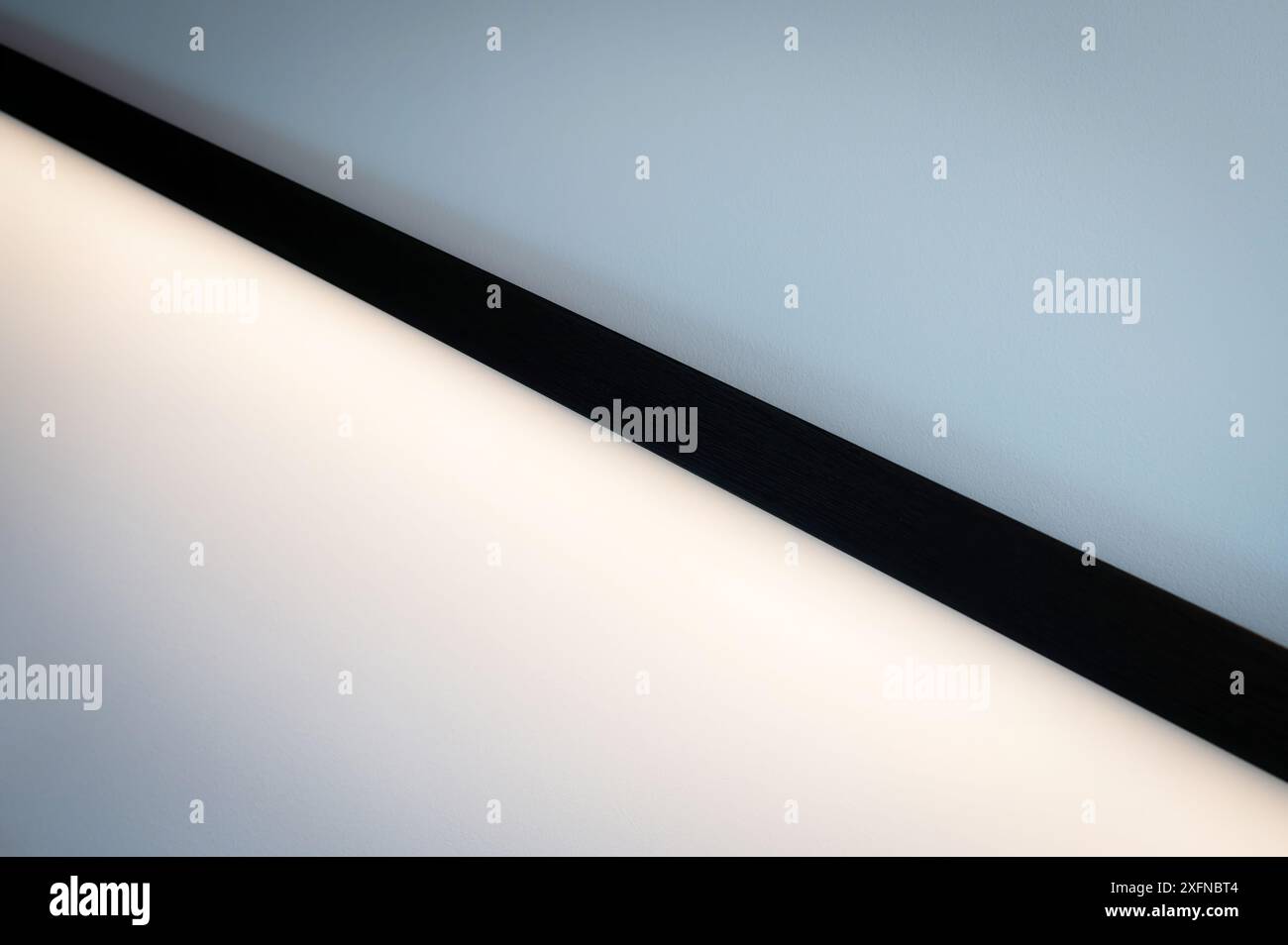 Light and shadows lines on the white and blue wall. Led line, the light ...
