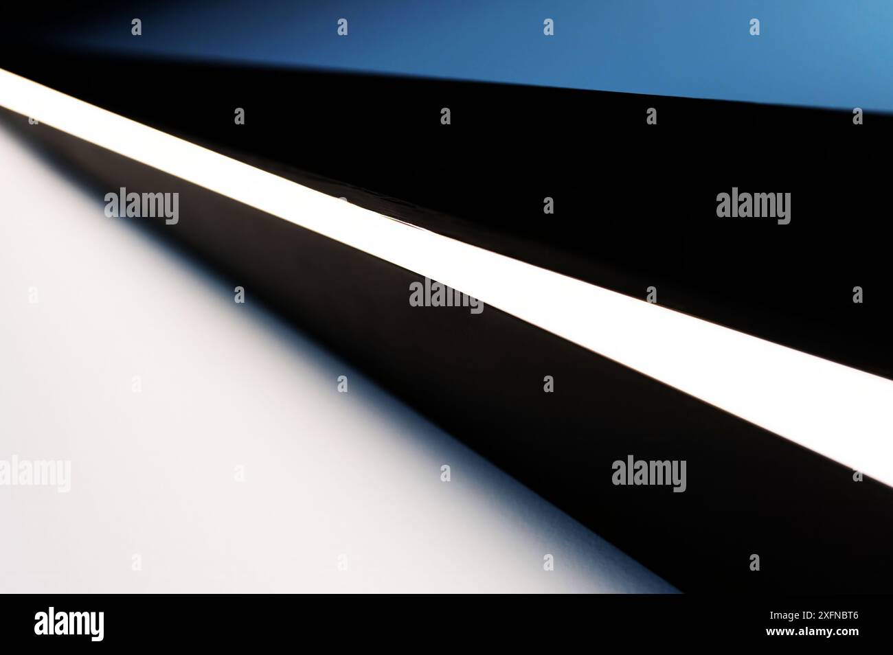 Light and shadows lines on the white and blue wall. Led line, the light ...