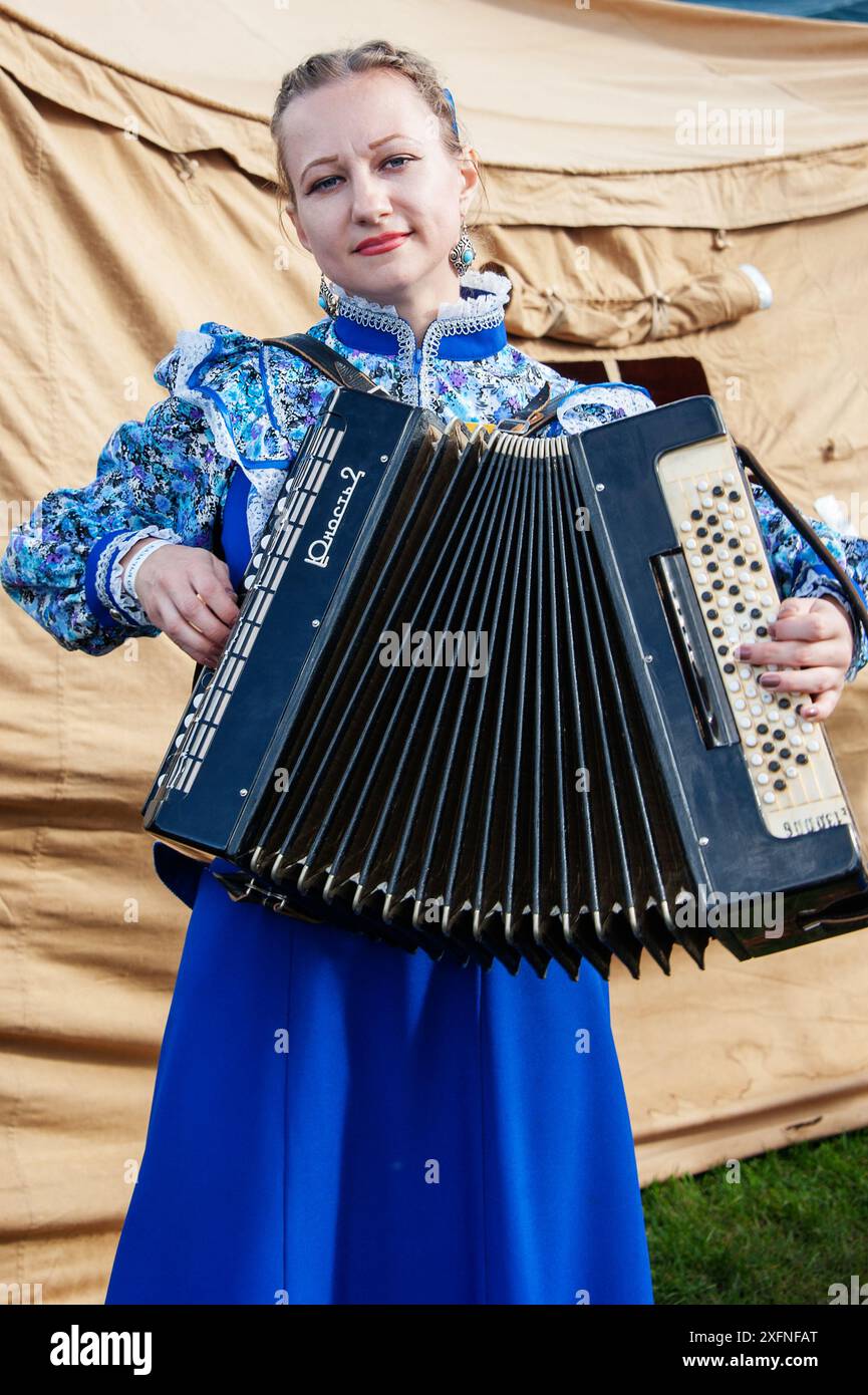 Girl playing harmonica hi-res stock photography and images - Alamy