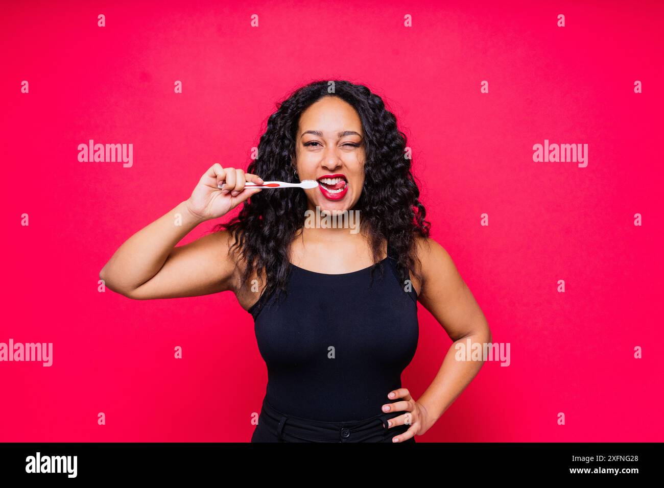 Pretty african lady with beautiful smile holding toothbrush and taking ...