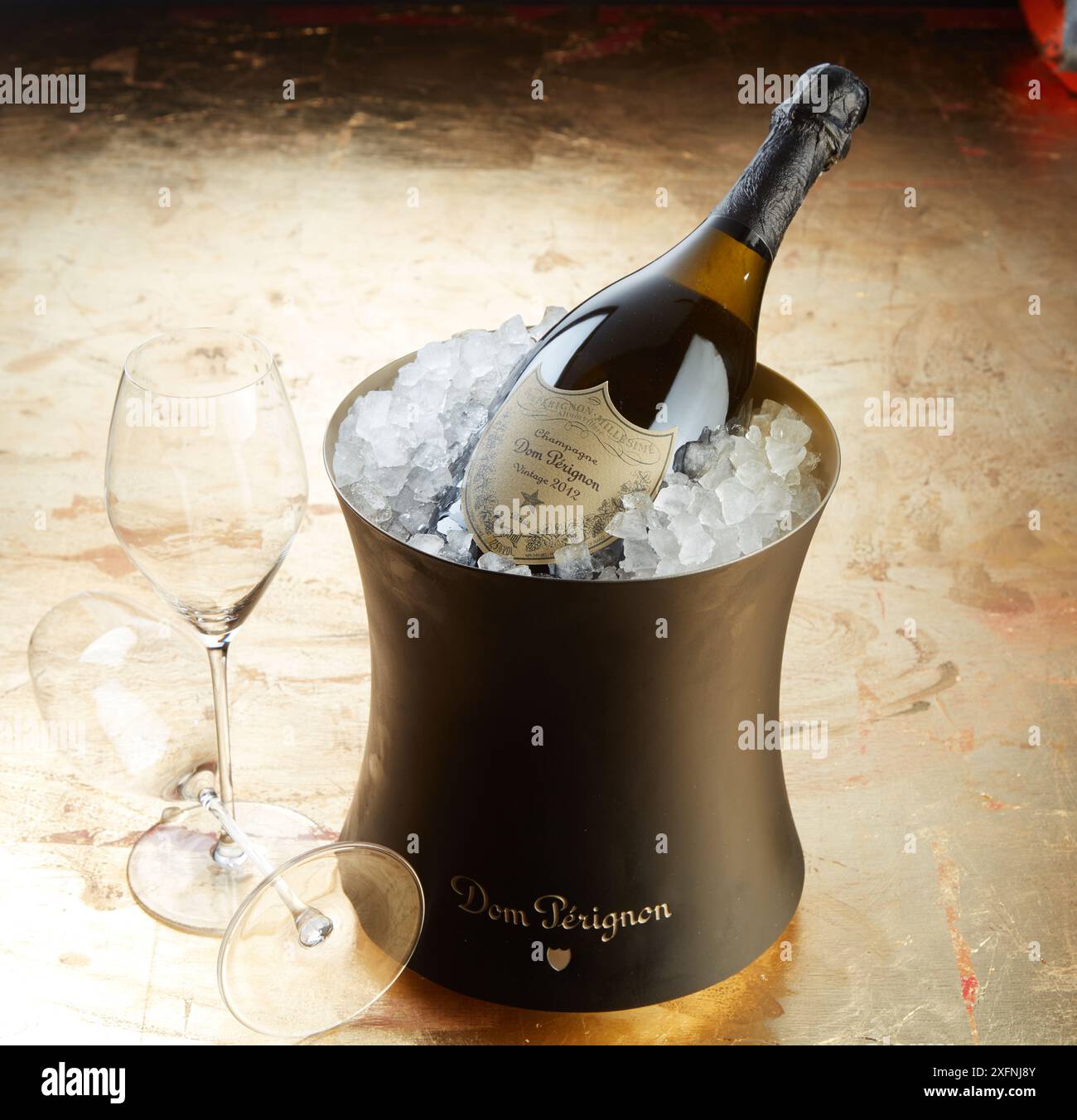 elegant sparkling bottle of vintage Dom Perignon champagne in gold ...