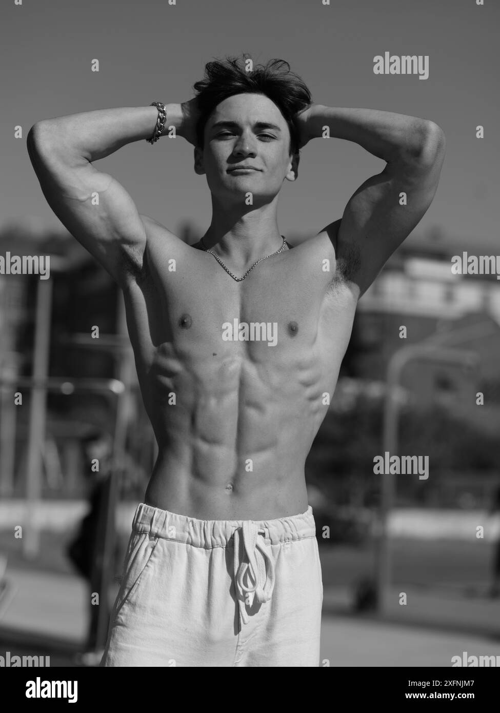 Muscular man working out on the beach in Helsingborg, Sweden Stock ...