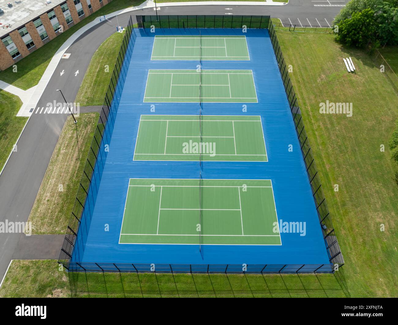 Aerial, drone, photo of new outdoor green tennis courts with white ...