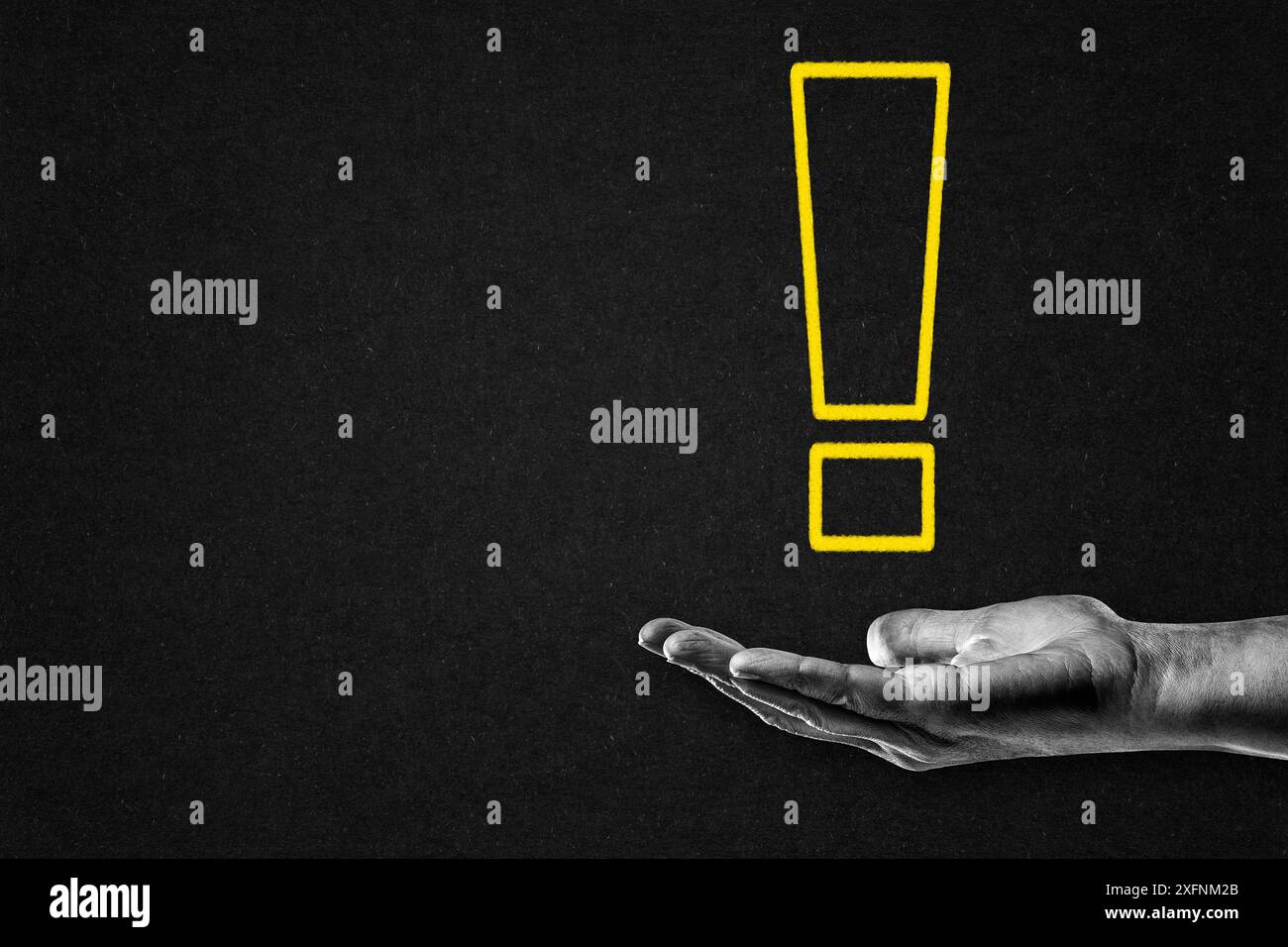 Yellow Exclamation Point on Hand in Black and White, Copy Space Stock ...