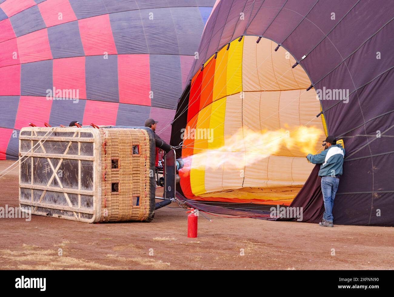 Hot air balloon inflation with a gas burner producing a large flame ...