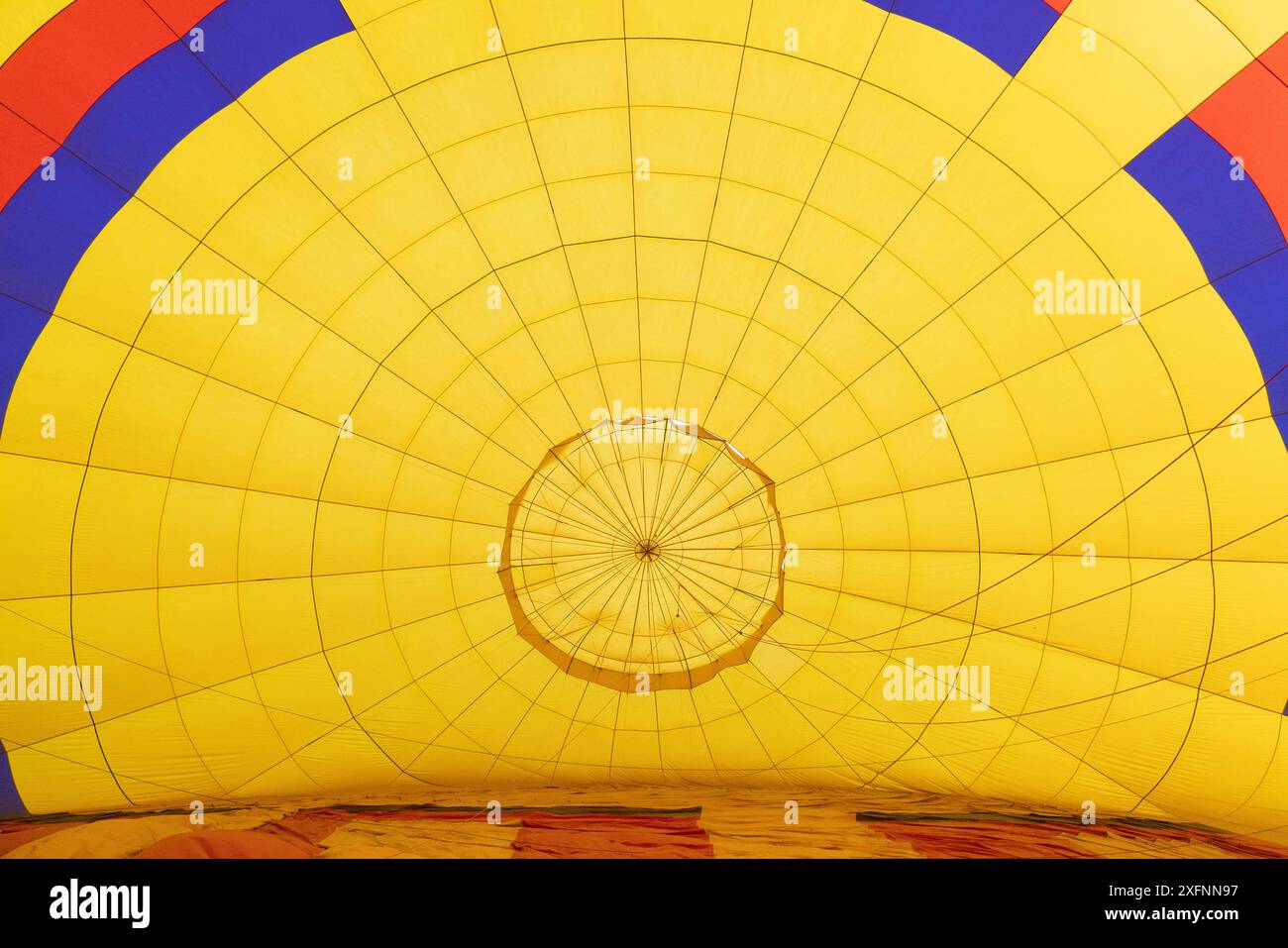 Interior or inside of a colourful hot air balloon during inflation ...