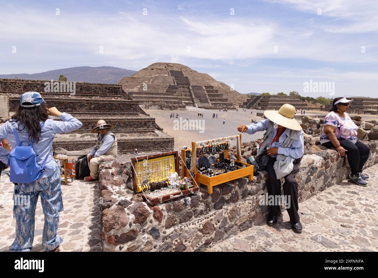 Mexico tourism summer; Tourists and traders selling goods; the ...