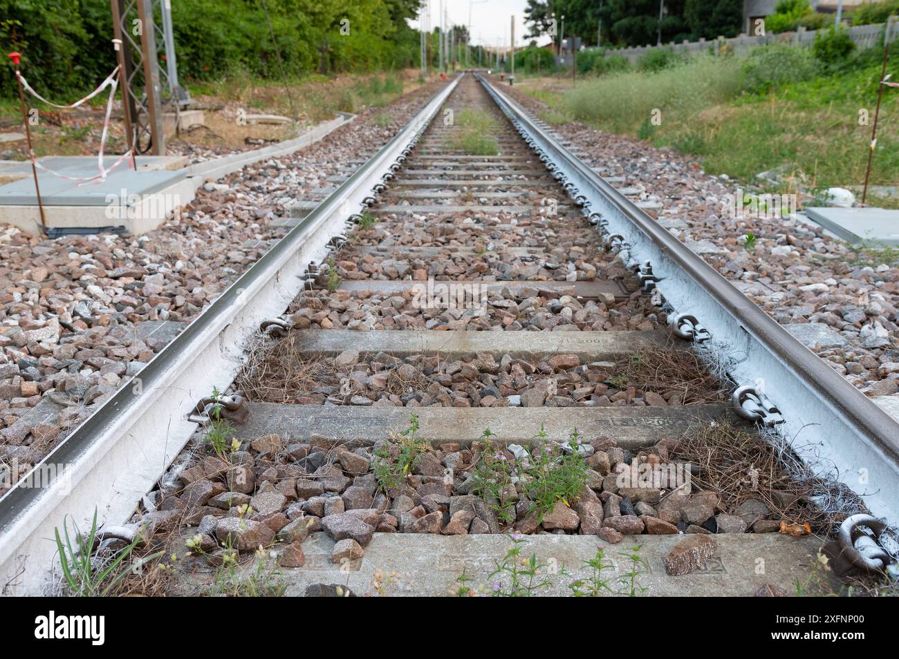 The parralel tracks of a railway going to infinity Stock Photo - Alamy