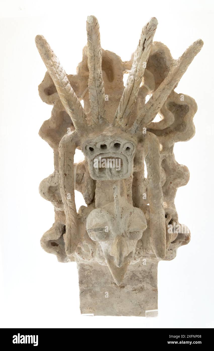 Mayan art - terracotta roof ornament of a macaw emerging from foliage ...