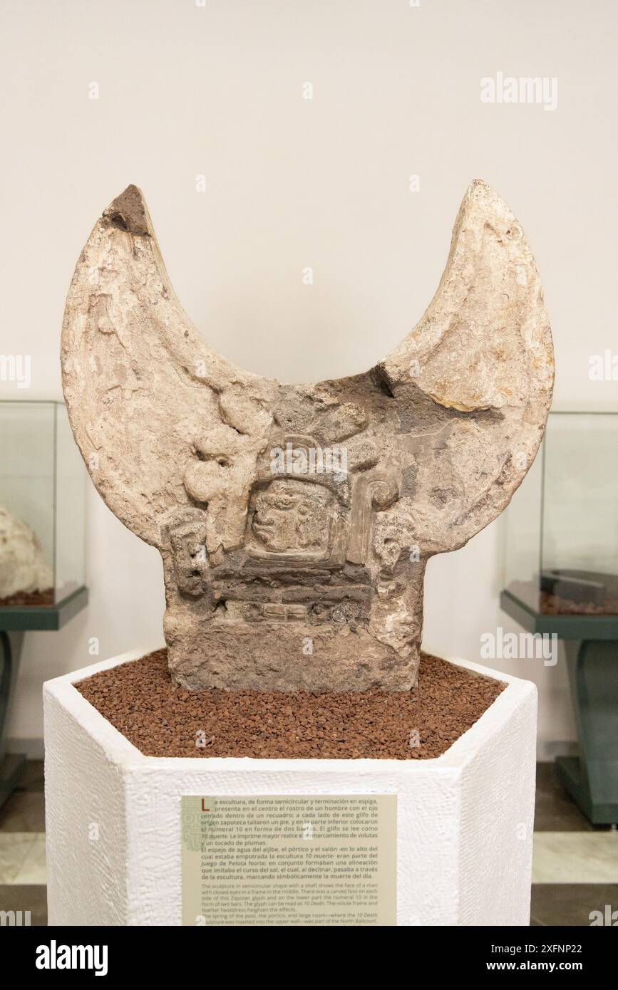 Maya sculpture; Semicircular stone maya sculpture with the face of a ...
