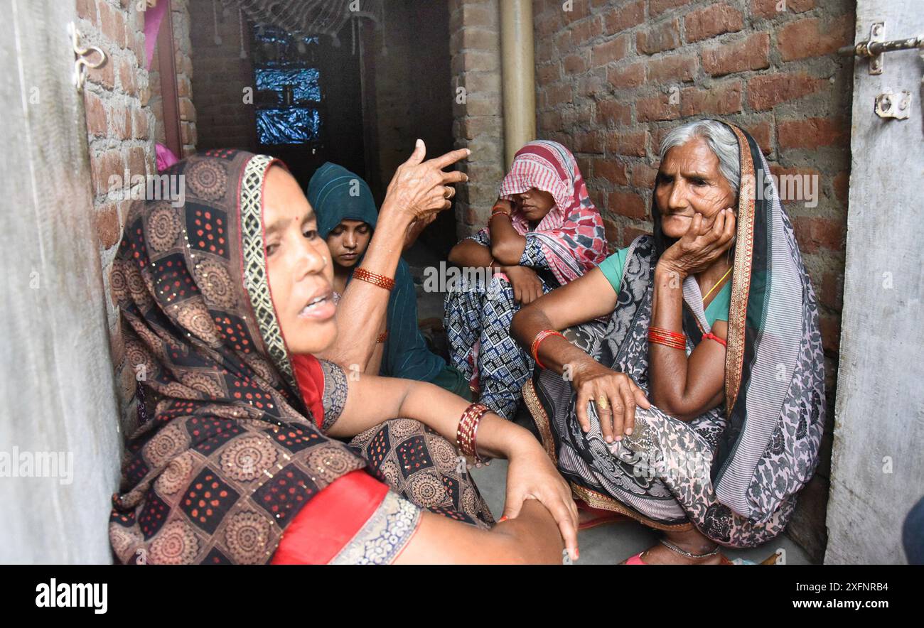 HATHRAS, INDIA - JULY 4: family members are saddened by the death of ...