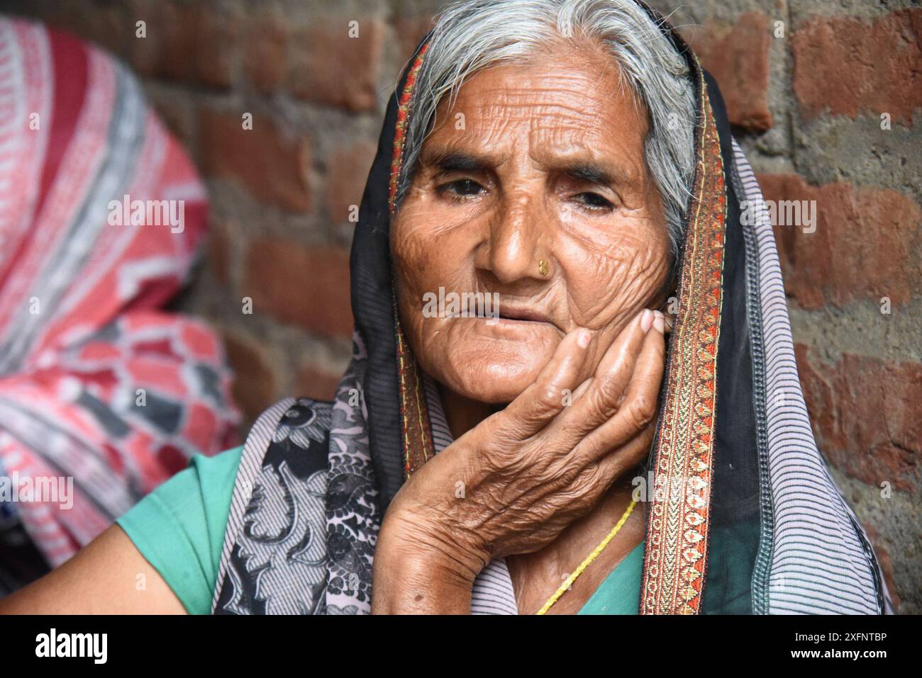 HATHRAS, INDIA - JULY 4: family members are saddened by the death of ...