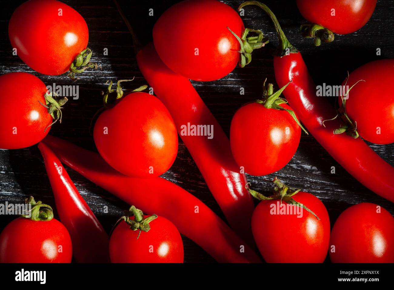 chili pepper cherry tomato on wood background top view Stock Photo - Alamy