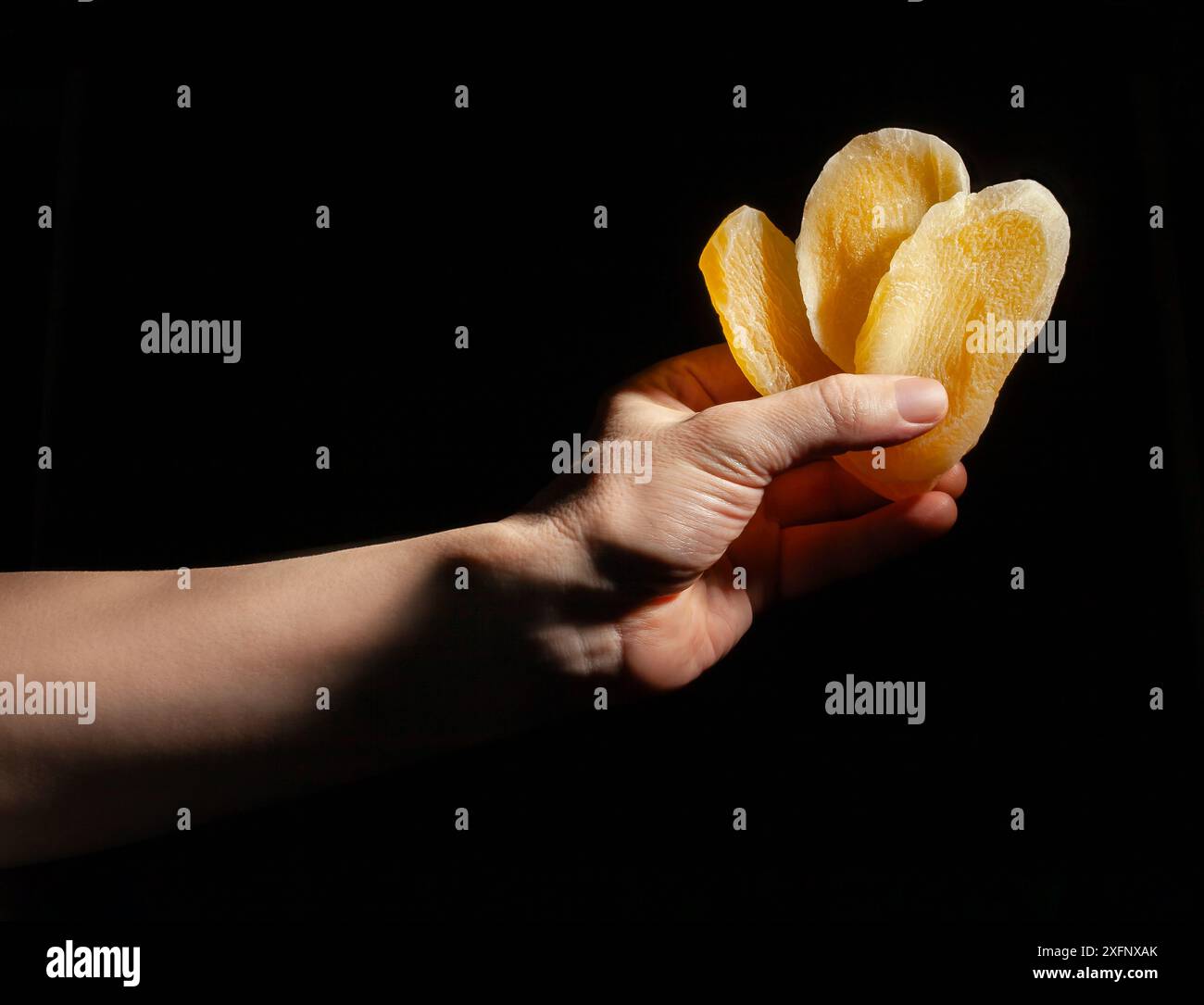 Fresh mango in hand hi-res stock photography and images - Alamy