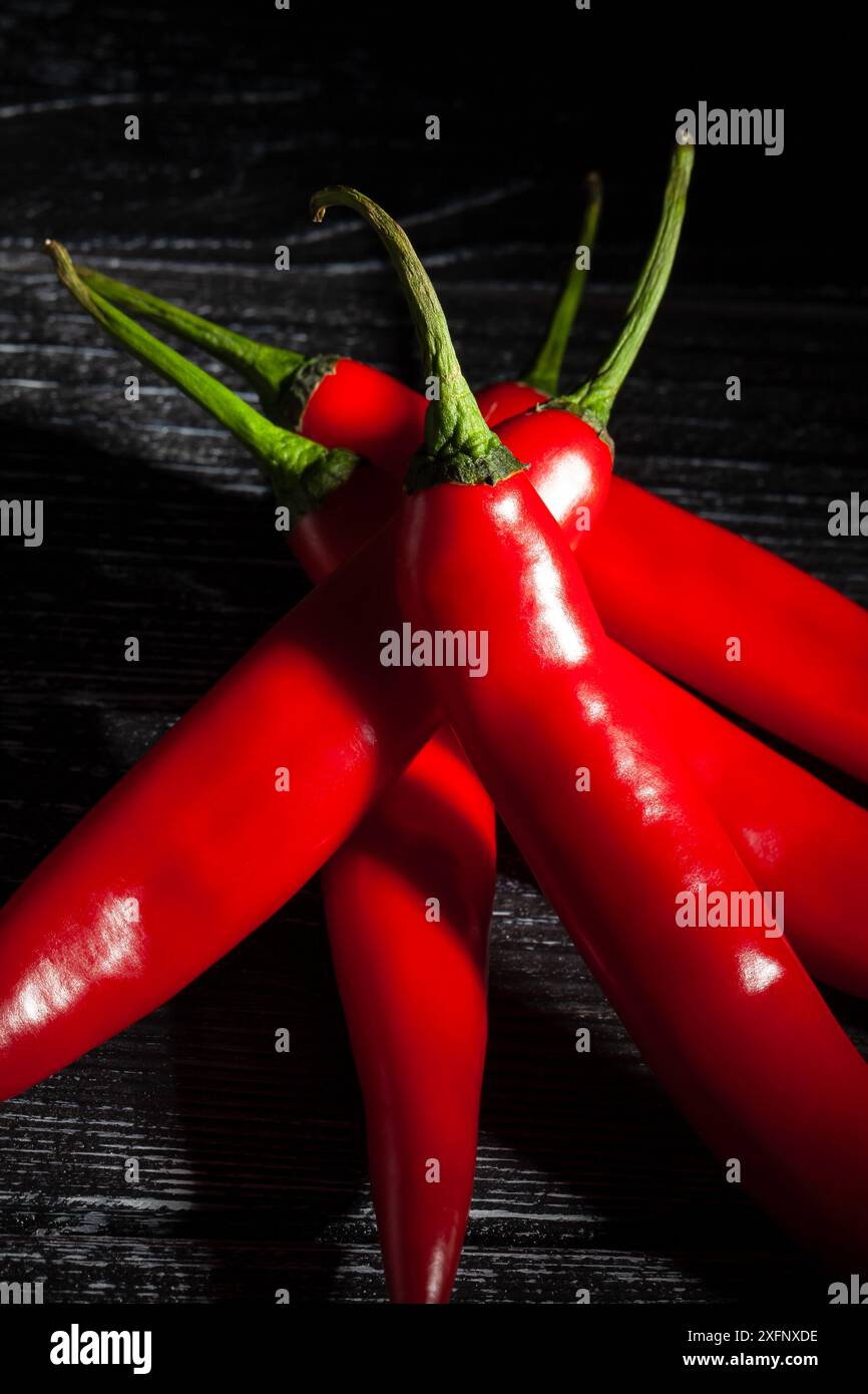 long chili pepper on black background Stock Photo - Alamy
