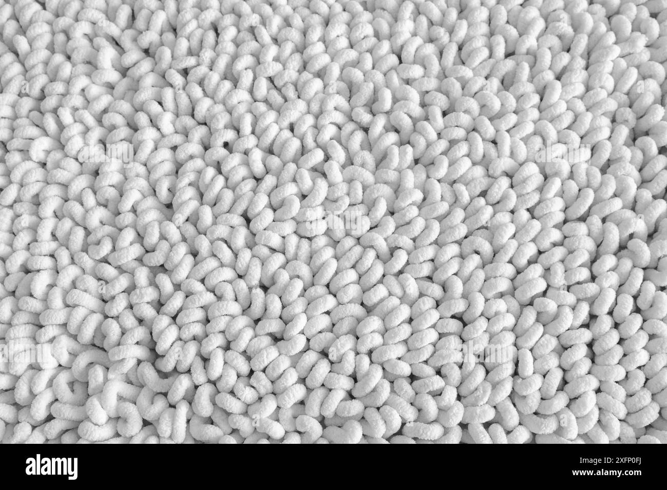 looped cotton fabric. Skeins of plush yarn for hand knitting with ready ...