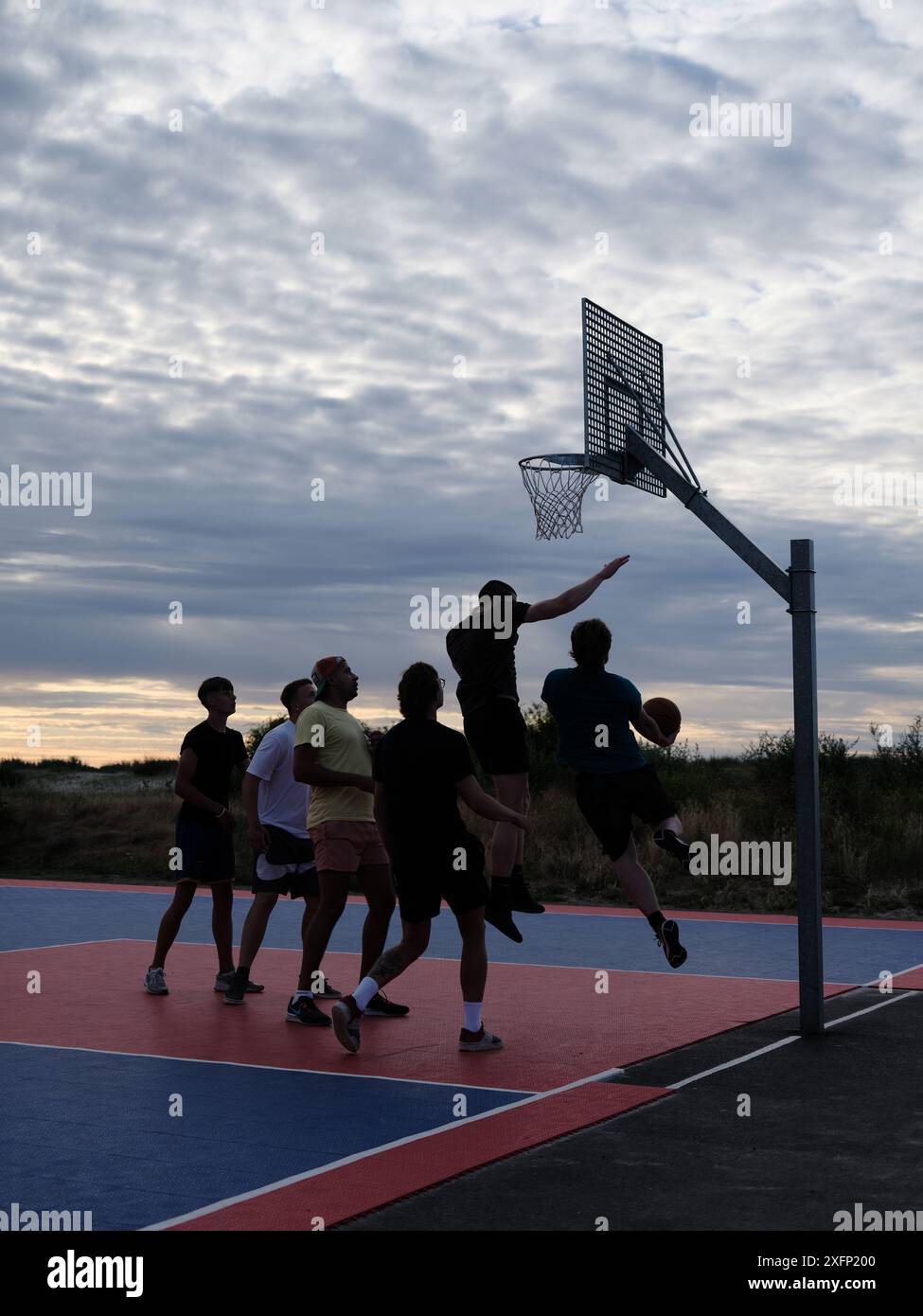 Men playing basketball at the beach in Malmö, Sweden Stock Photo - Alamy
