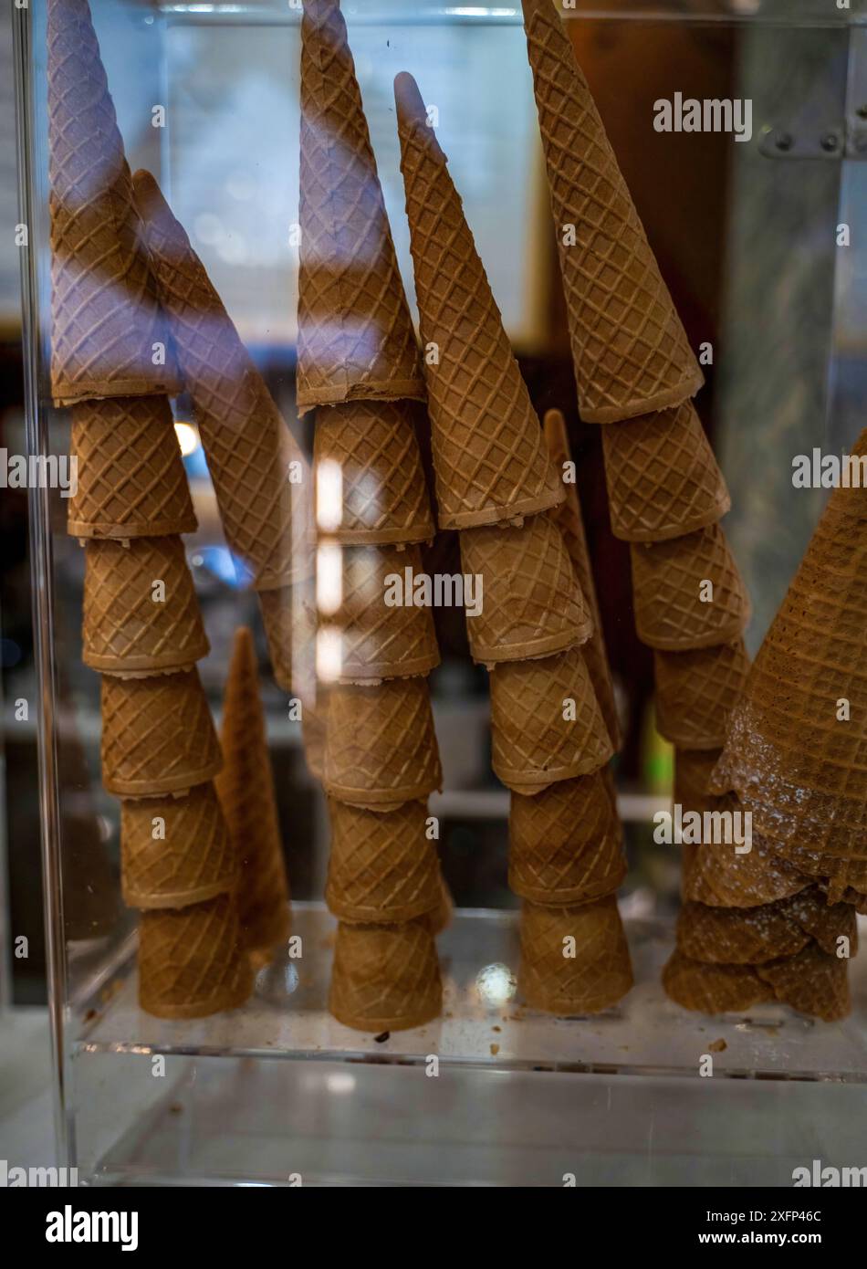 A pile of waffle cones for ice cream ready to be filled with ice cream ...