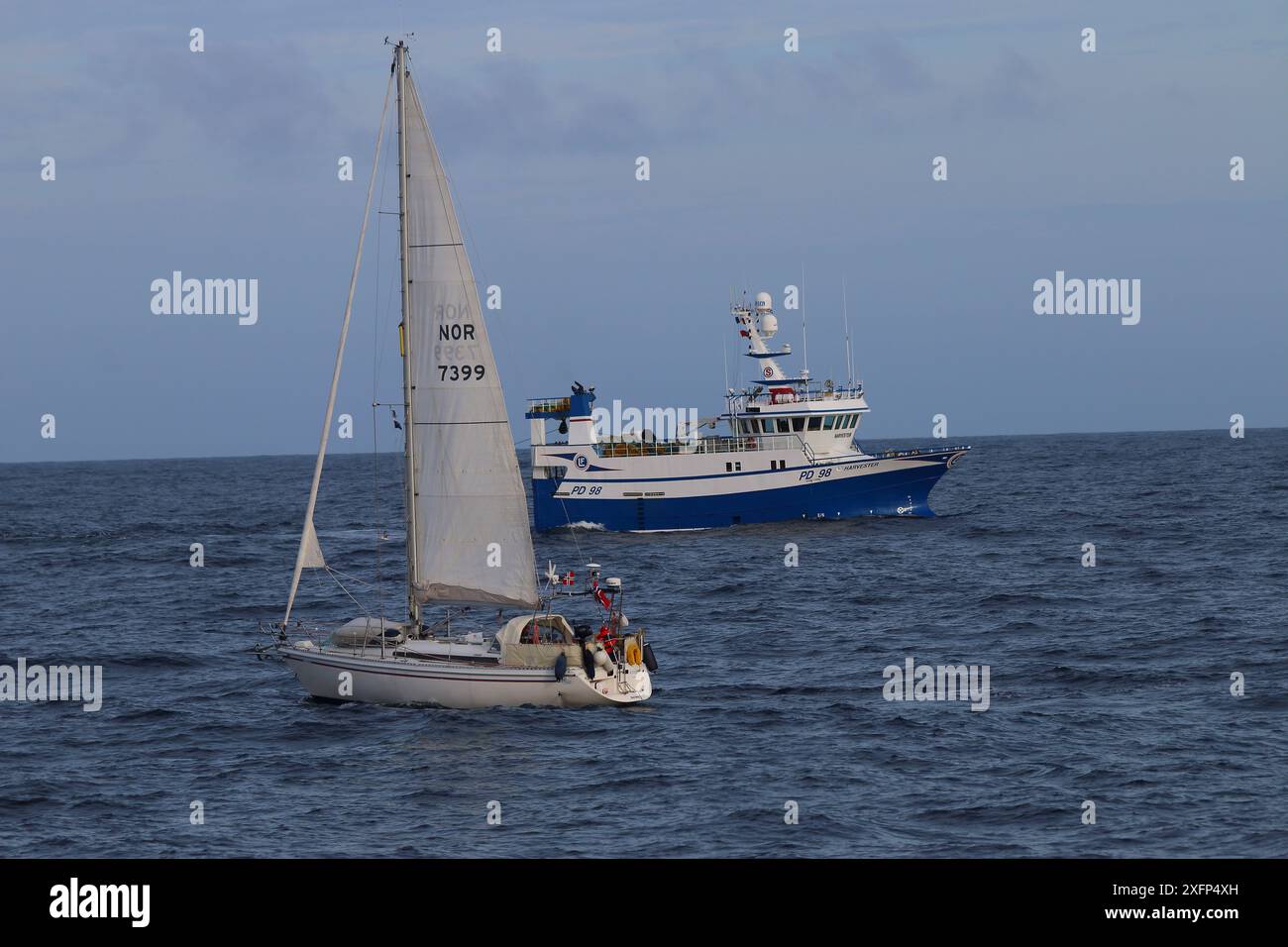 Yacht and fishing vessel crossing paths on the North Sea, June 2016 ...