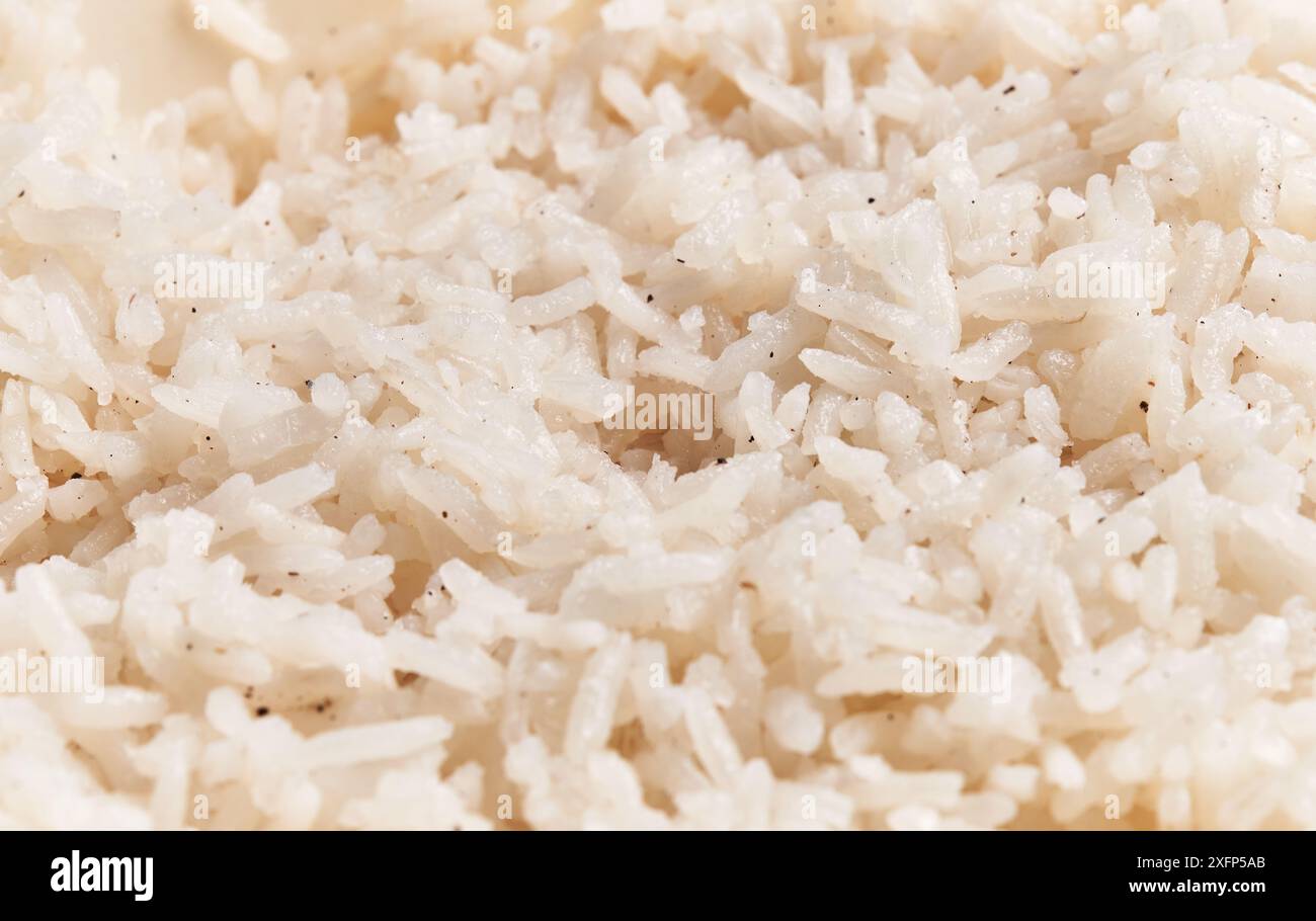 Close-up view of steamed white rice, showcasing its texture and ...