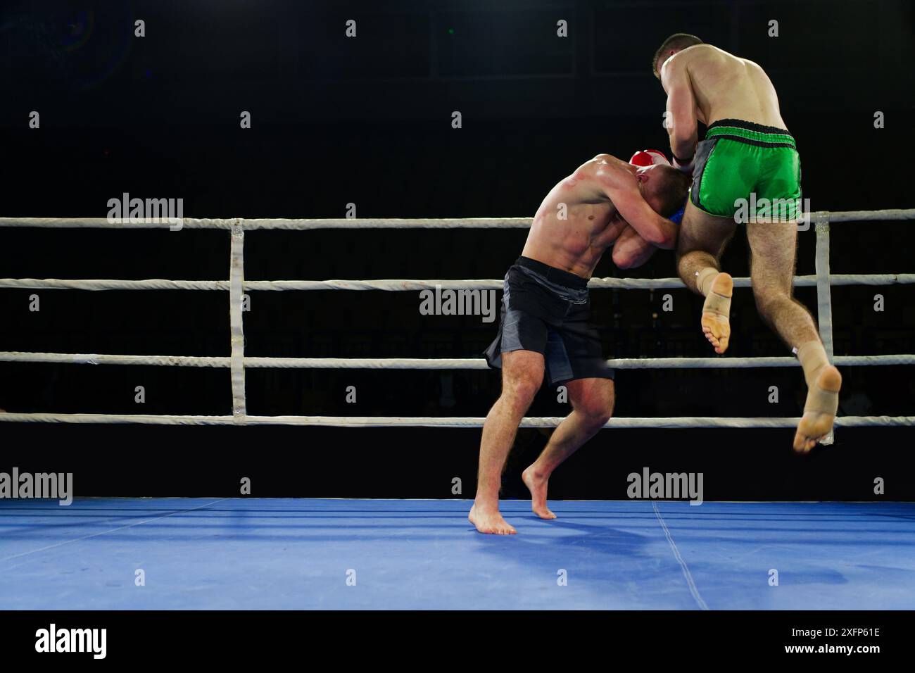 Kickboxing rivals unleash powerful leg strikes in a thrilling match ...
