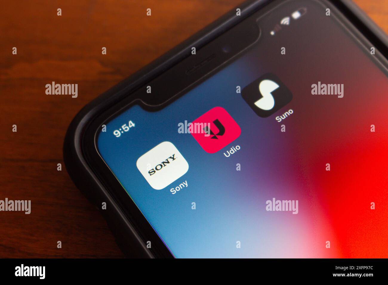 Sony, Udio and Suno logos seen in an iPhone. Sony Music Entertainment ...