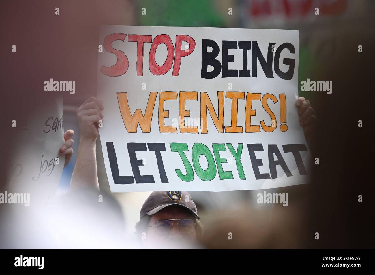 New York, USA. 04th July, 2024. People hold up signs for World champion ...