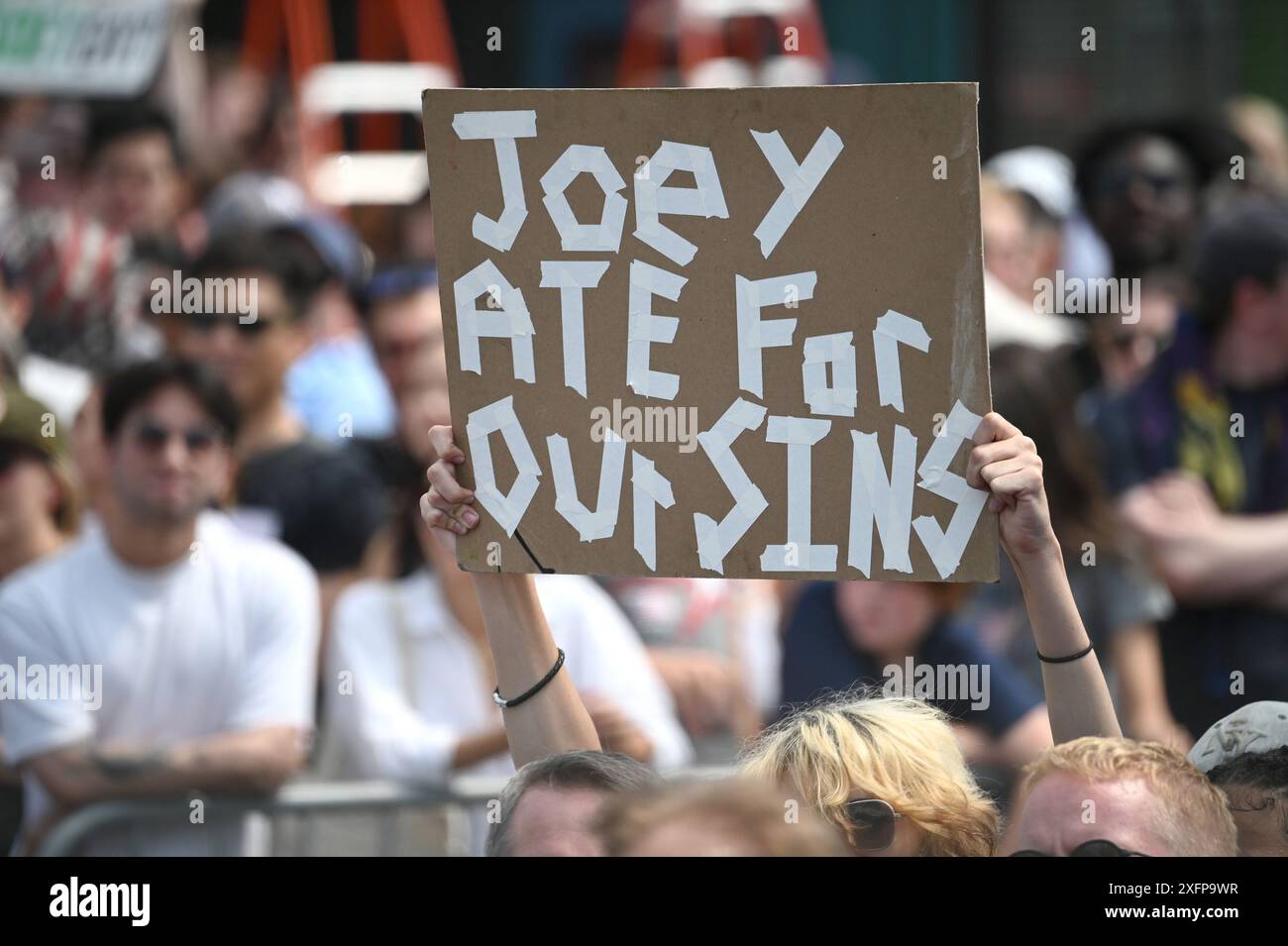 New York, USA. 04th July, 2024. People hold up signs for World champion ...
