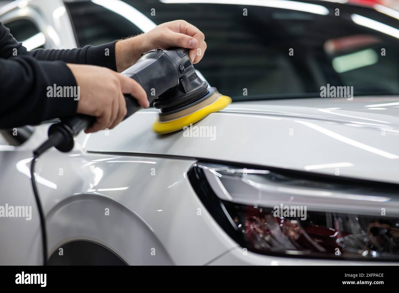 Process of polishing white car hood surface using orbital polishing ...