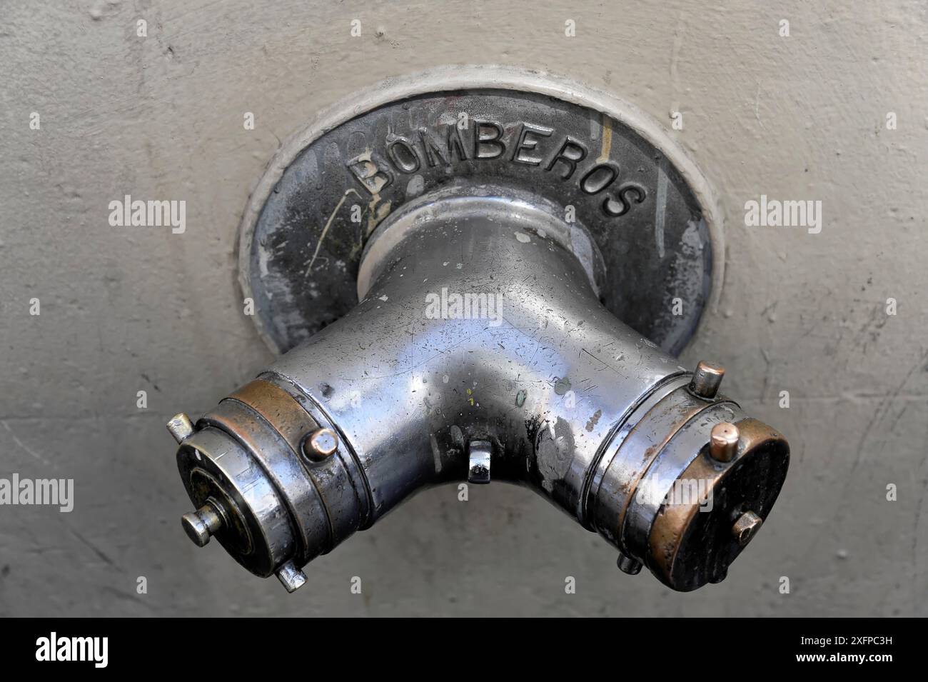 Mexico City, Mexico, Central America, A metal fire hydrant is attached ...