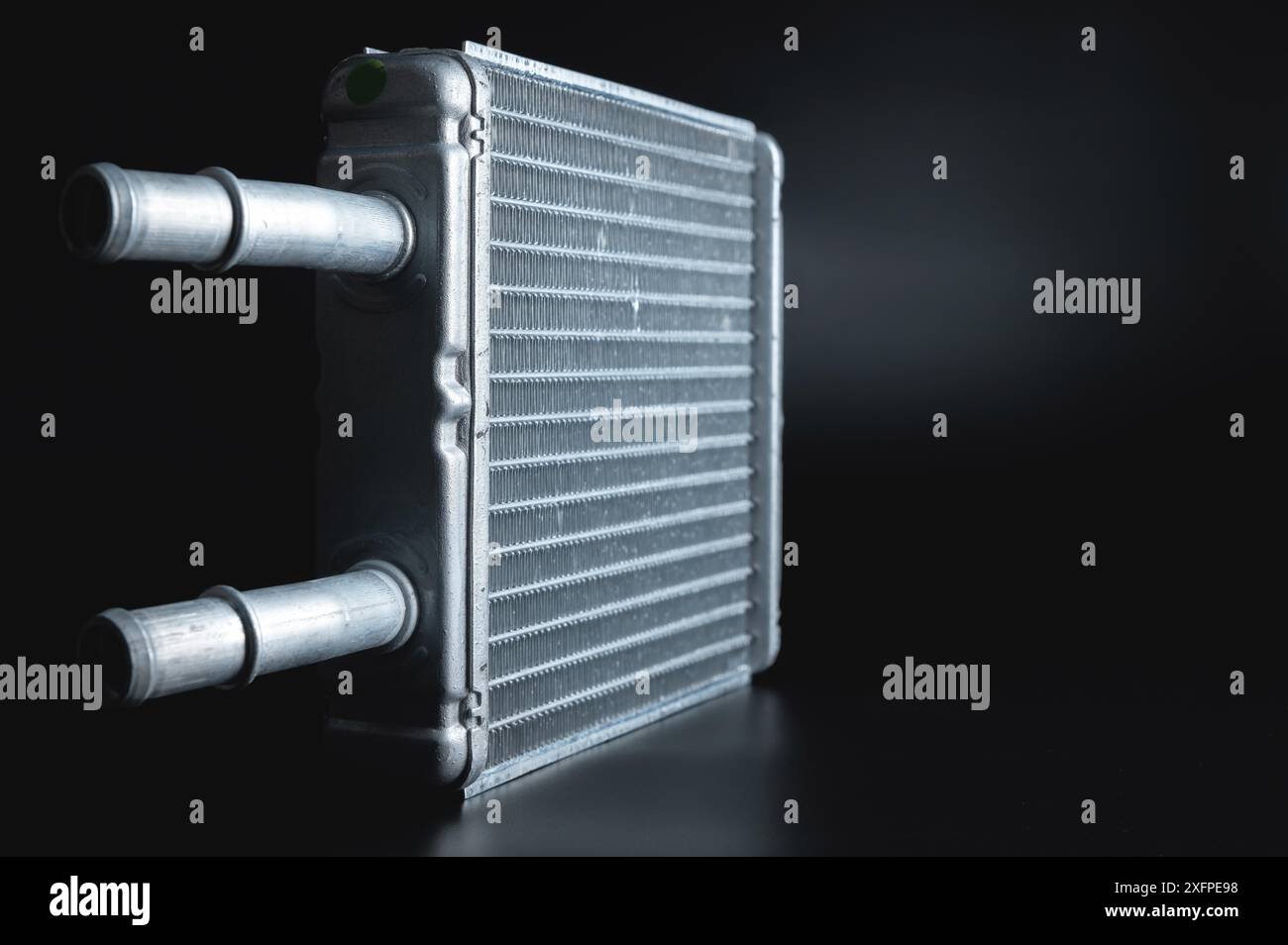 Aluminum new heater core. Car parts on a black background Stock Photo ...