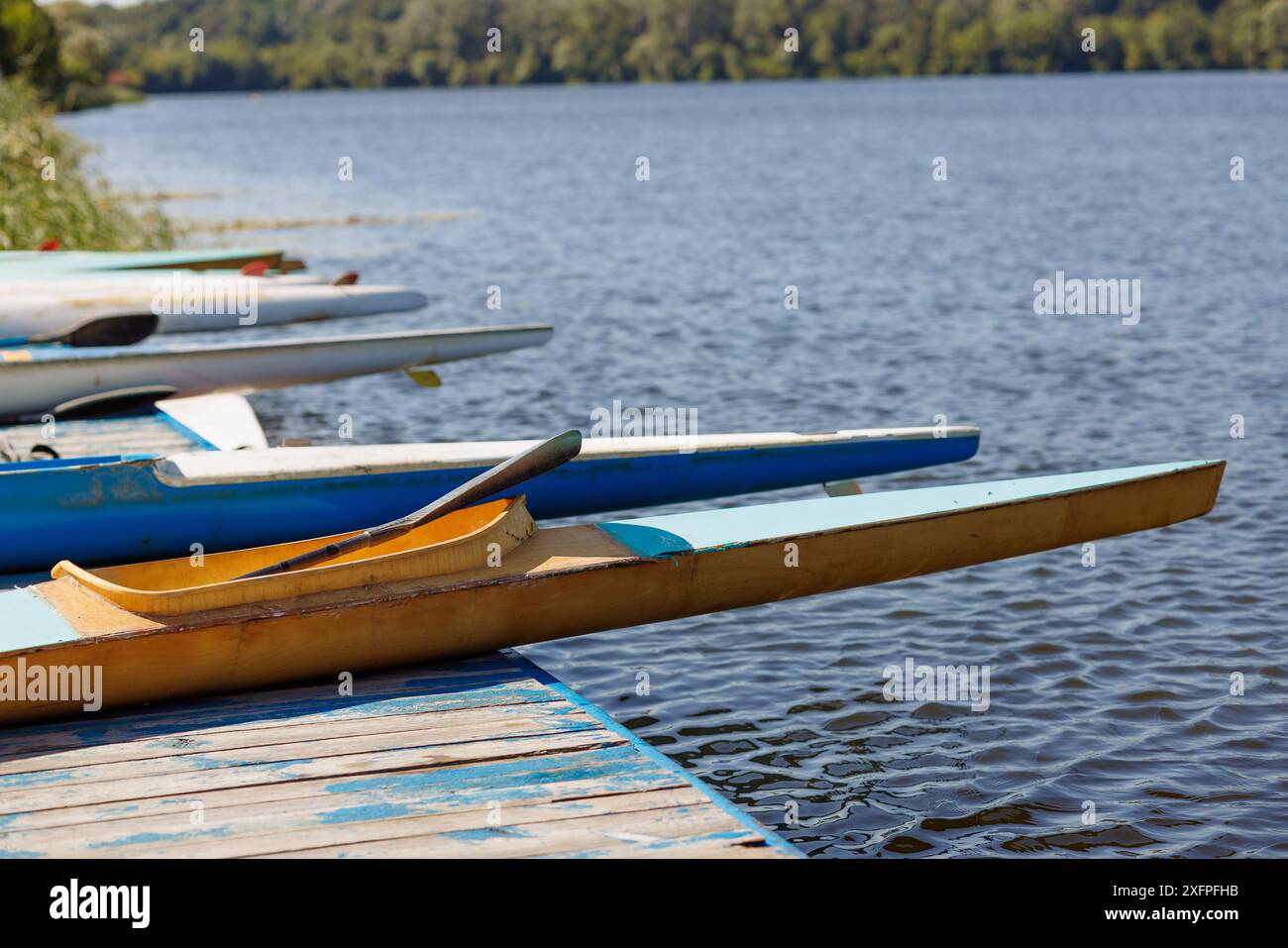 athlete putting on water kayak, water sport, kayaking and canoeing ...