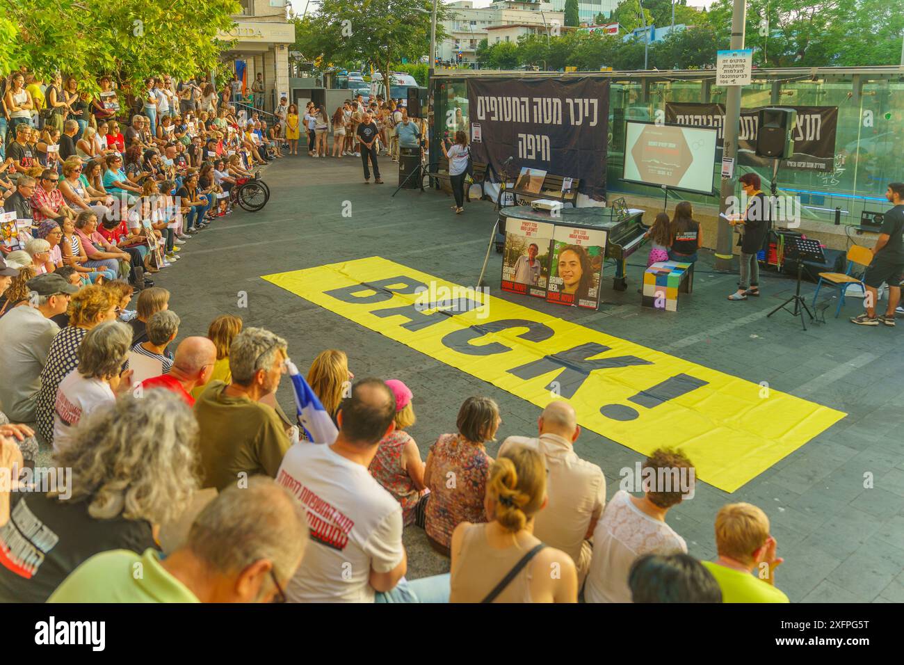 Haifa, Israel - July 04, 2024: Crowd of people attend an assembly of ...